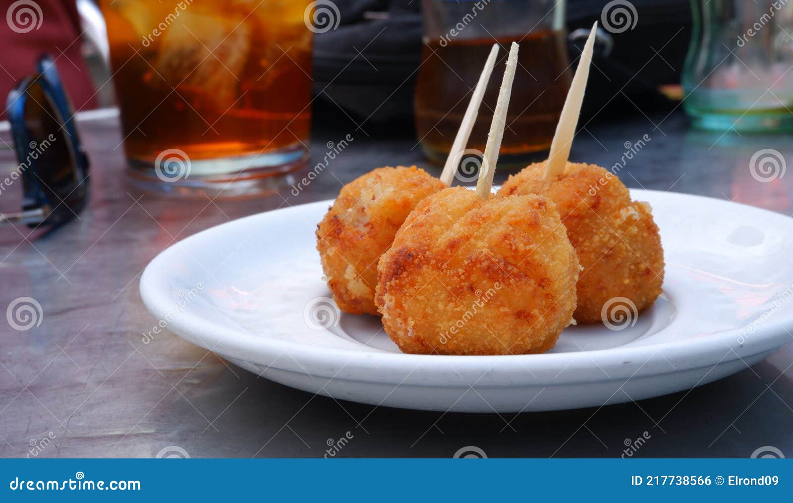 Croquette in a Plate with Drink Behind Stock Photo - Image of glass ...