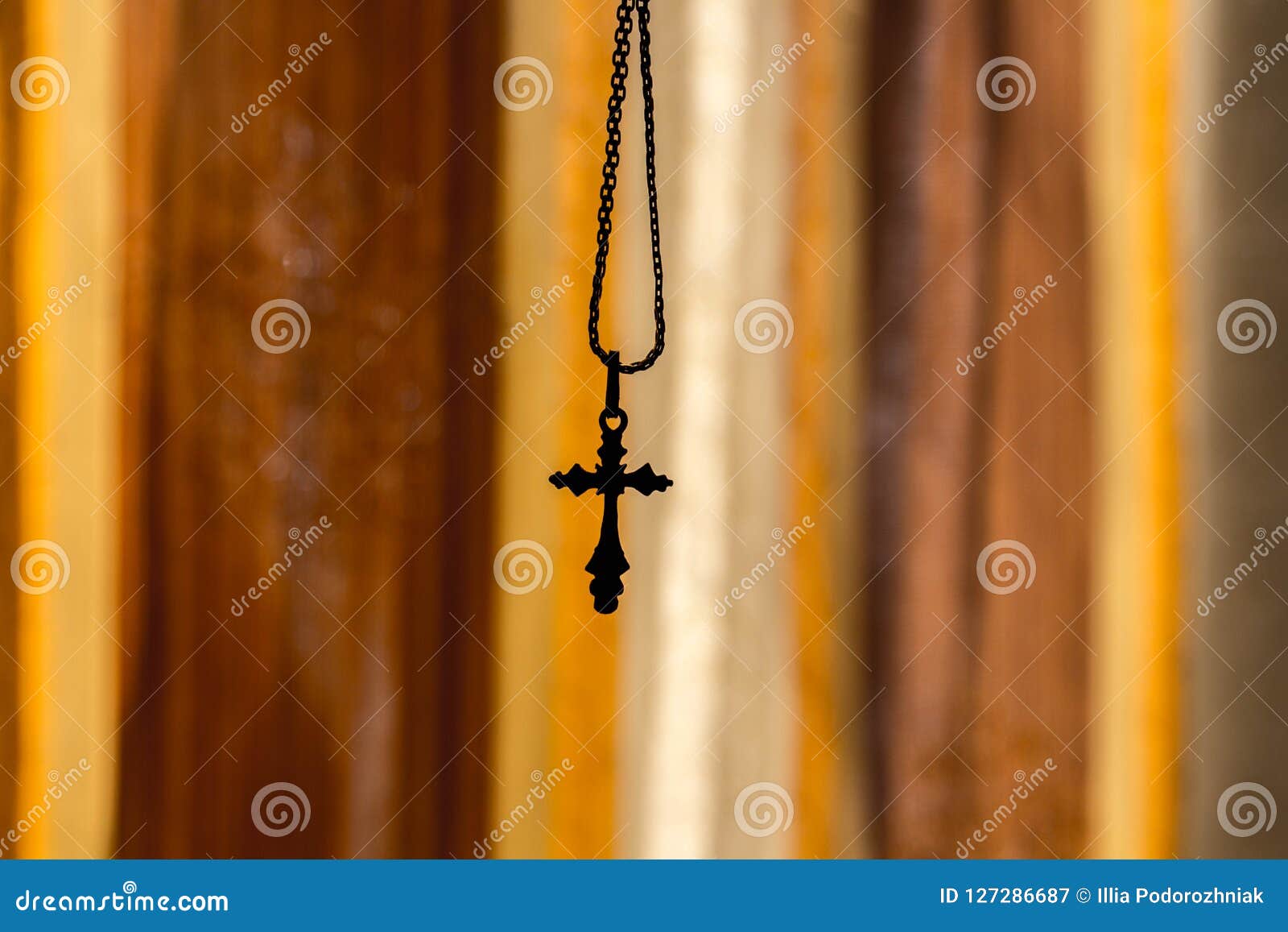 A Cross on a Chain on an Orange Background Stock Image - Image of ...