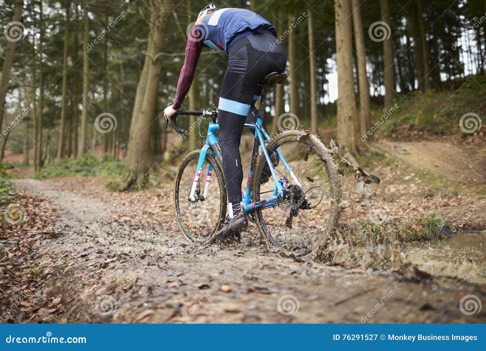 Cross-country Cyclist Riding in Mud, Low Angle Back View Stock Image ...