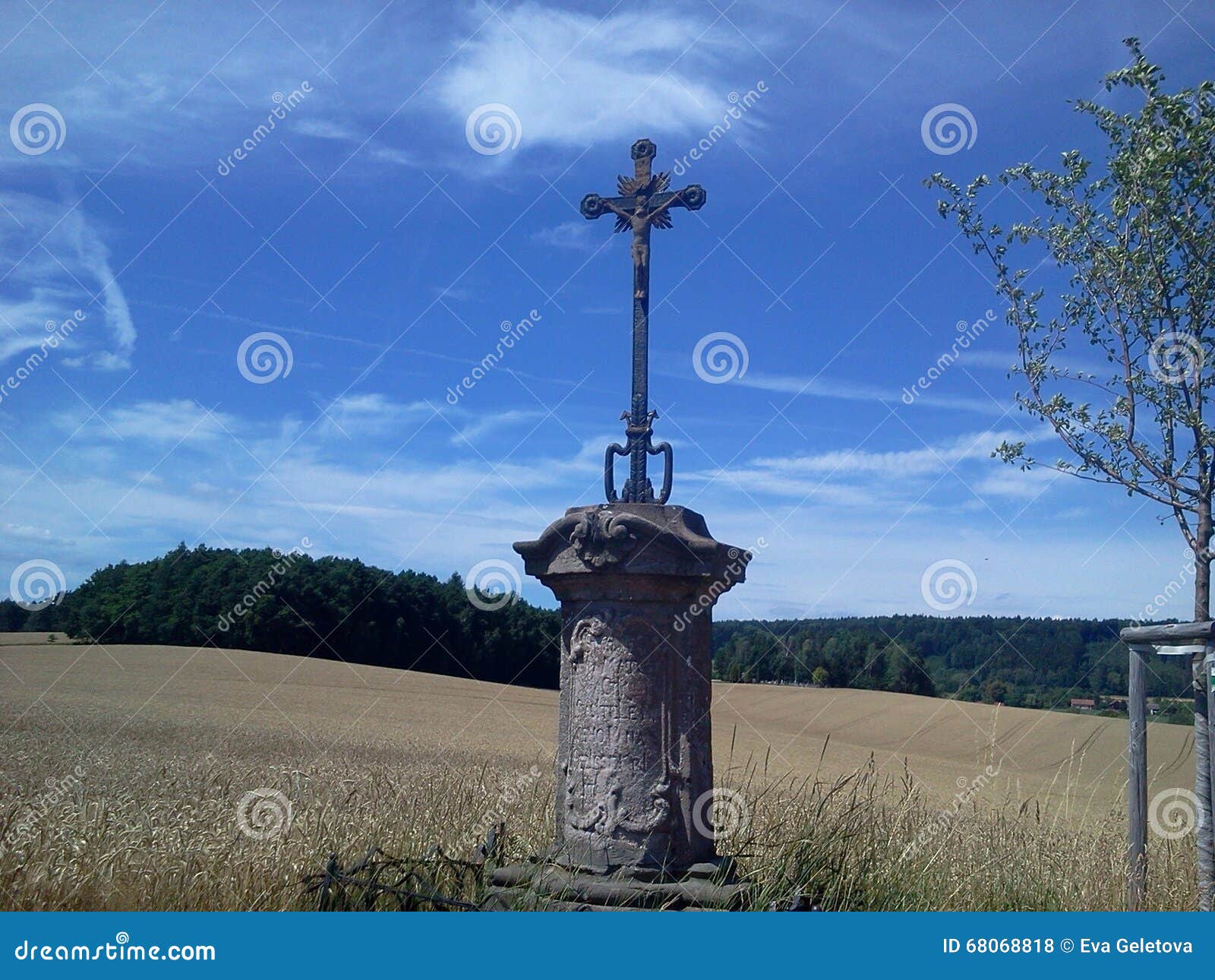An Ancient Cross Of The Crucifixion Of Jesus Christ And A Statuette Of ...