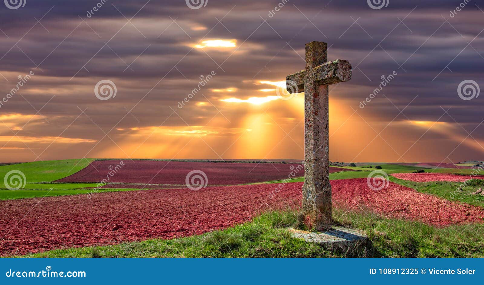 A Cross in the Field with a Sunset Behind Stock Image - Image of holy ...