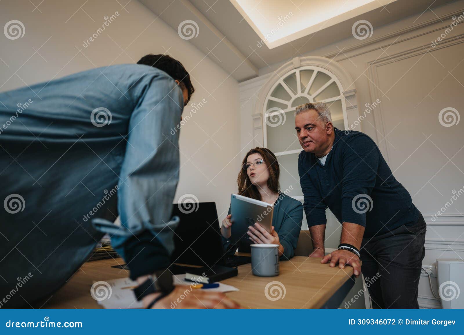 Cross Generational, Multicultural, Business Team Collaborating on ...