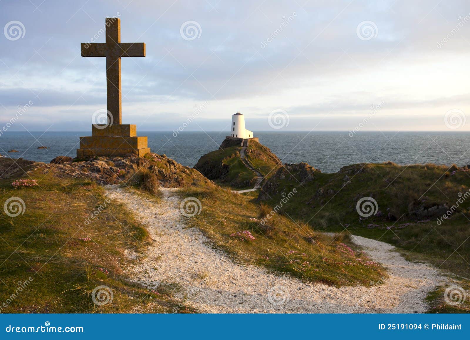 Cross and lighthouse stock photo. Image of llanddwyn - 25191094
