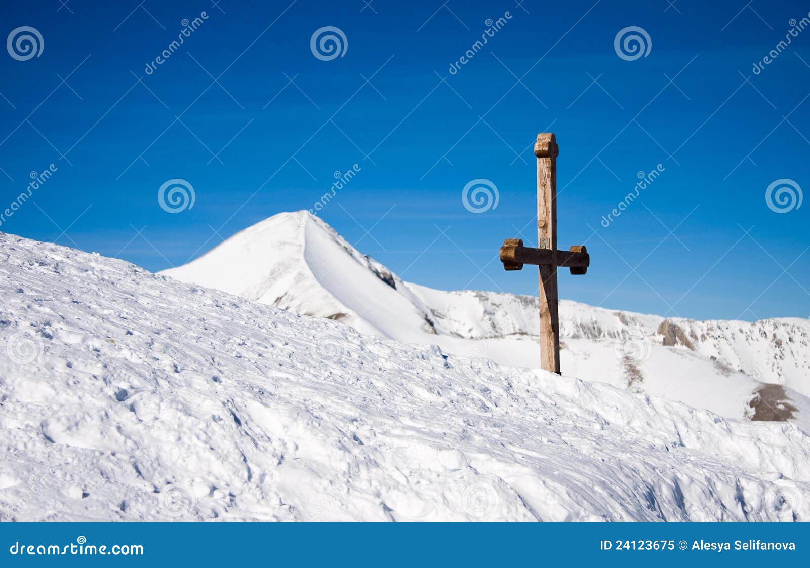 Cross in snowy mountains stock image. Image of clear - 24123675