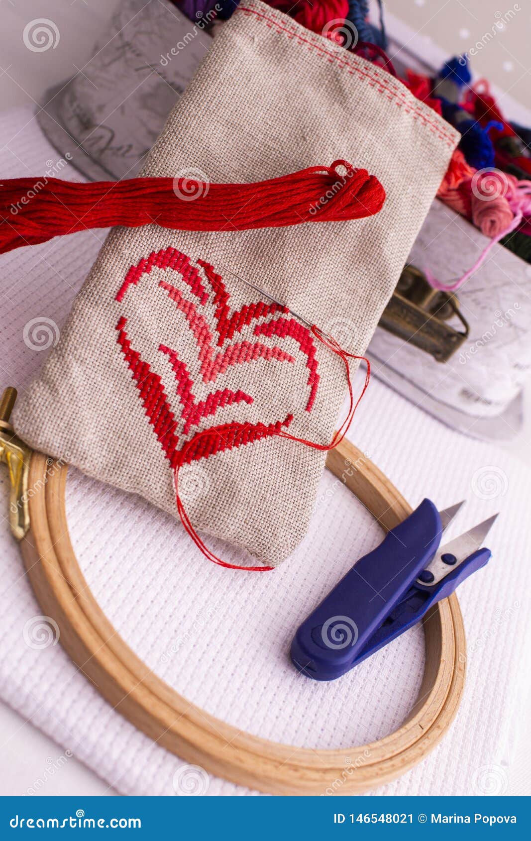 Cross stitch, red color stock image. Image of creation - 146548021