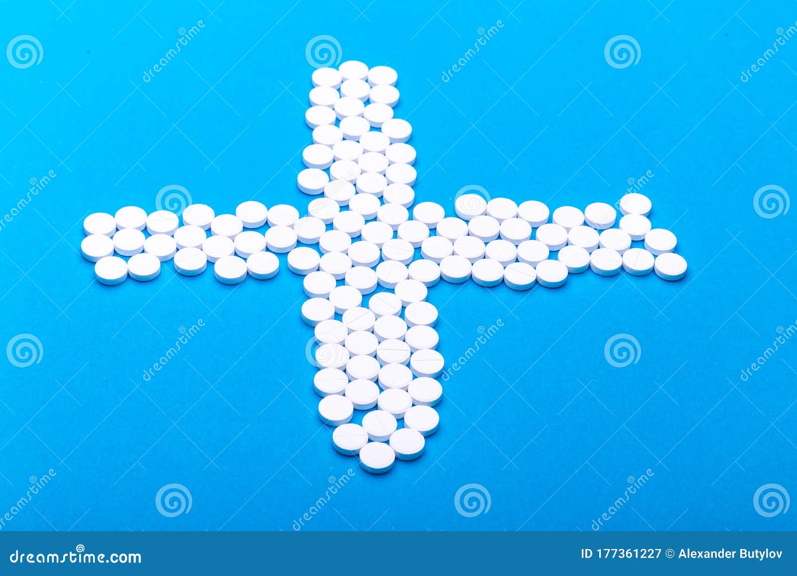 Cross of Tablets on a Blue Background Stock Image - Image of pharmacy ...