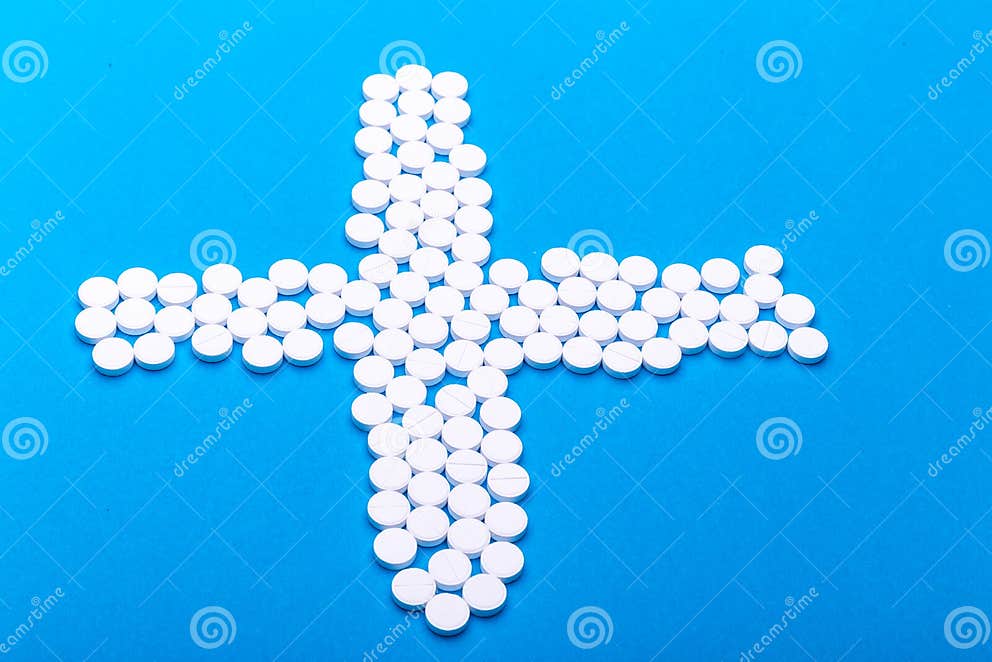 Cross of Tablets on a Blue Background Stock Image - Image of office ...