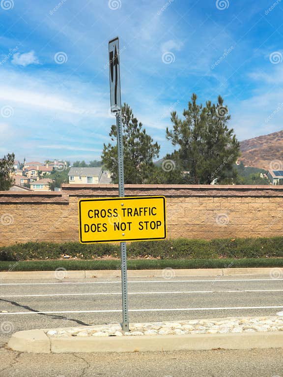 Cross Traffic Does Not Stop Warning Sign Stock Photo - Image of ...