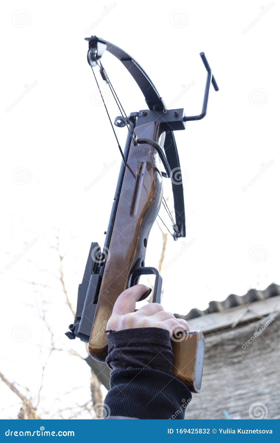 Crossbow in the Hands. Shot in the Sky. Weapons Strength and Authority ...