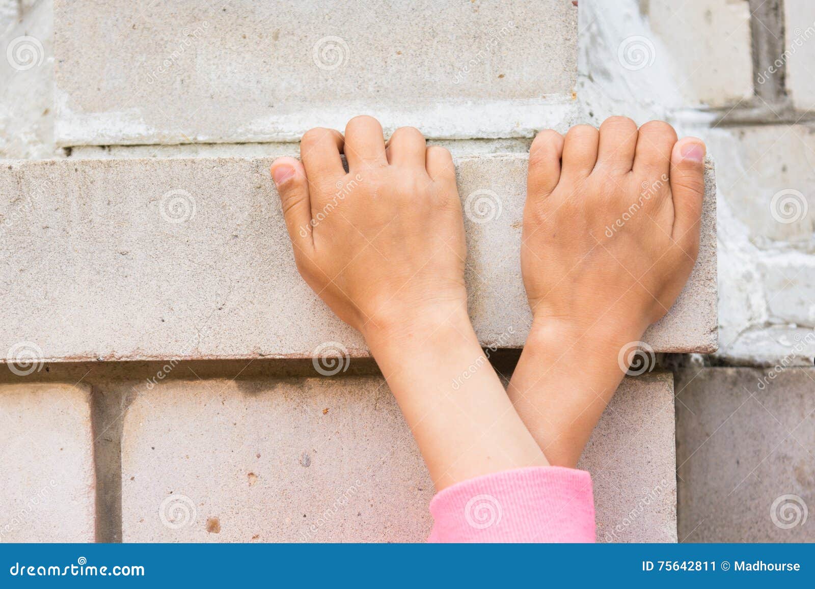 Crossed Children Hands Seized on the Brick Wall Stock Image - Image of ...