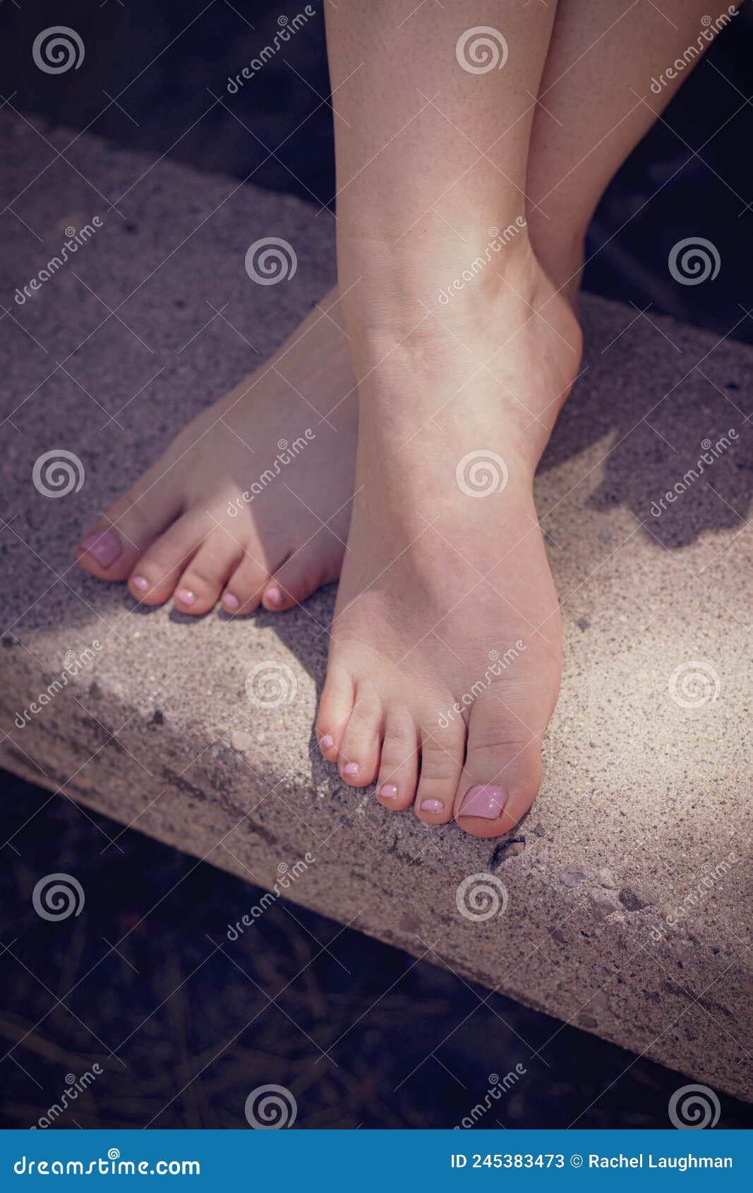 Crossed Feet on Concrete stock image. Image of barefoot - 245383473