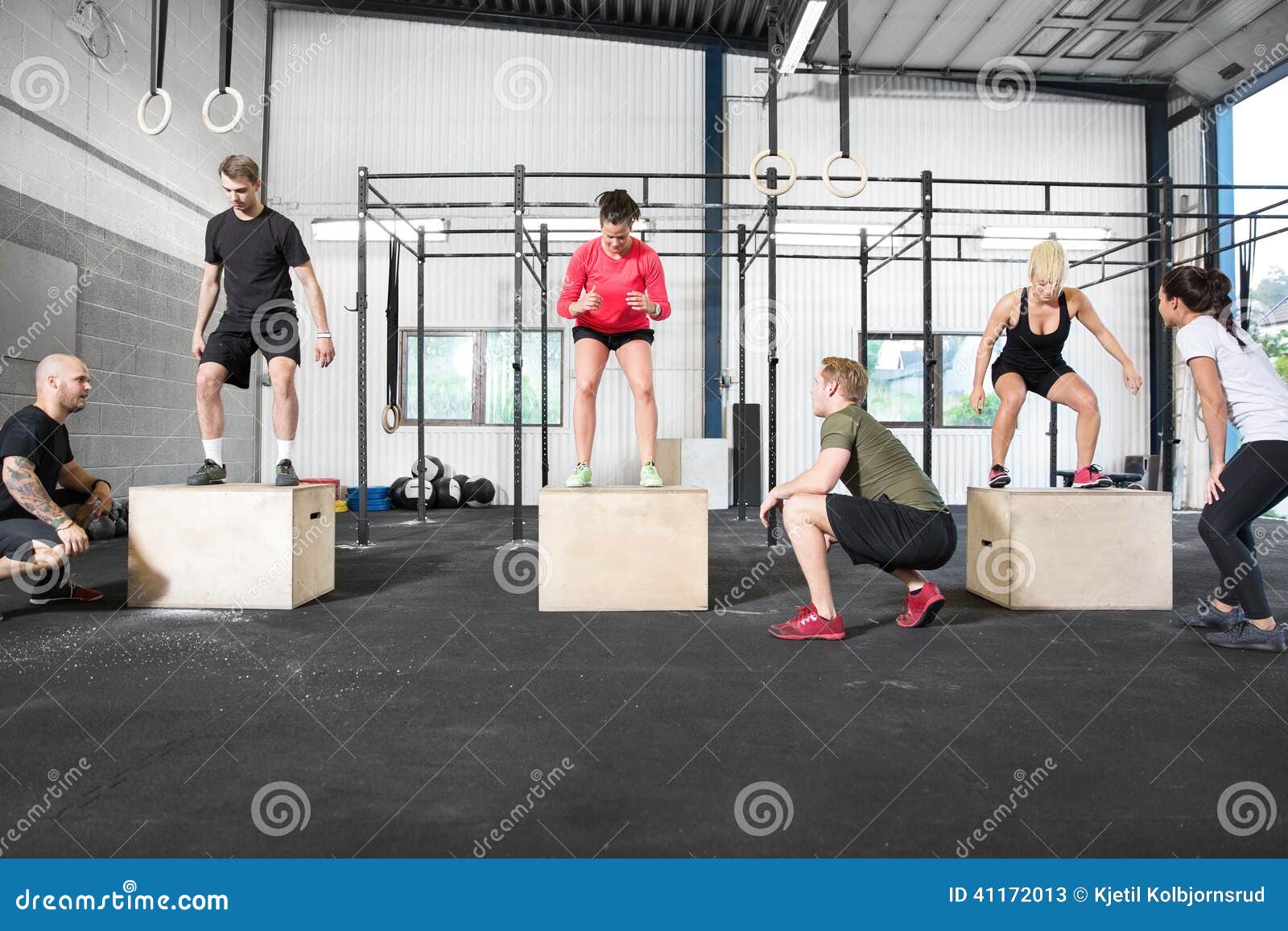 Crossfit Group Trains Box Jump Stock Image - Image of weight, garage ...