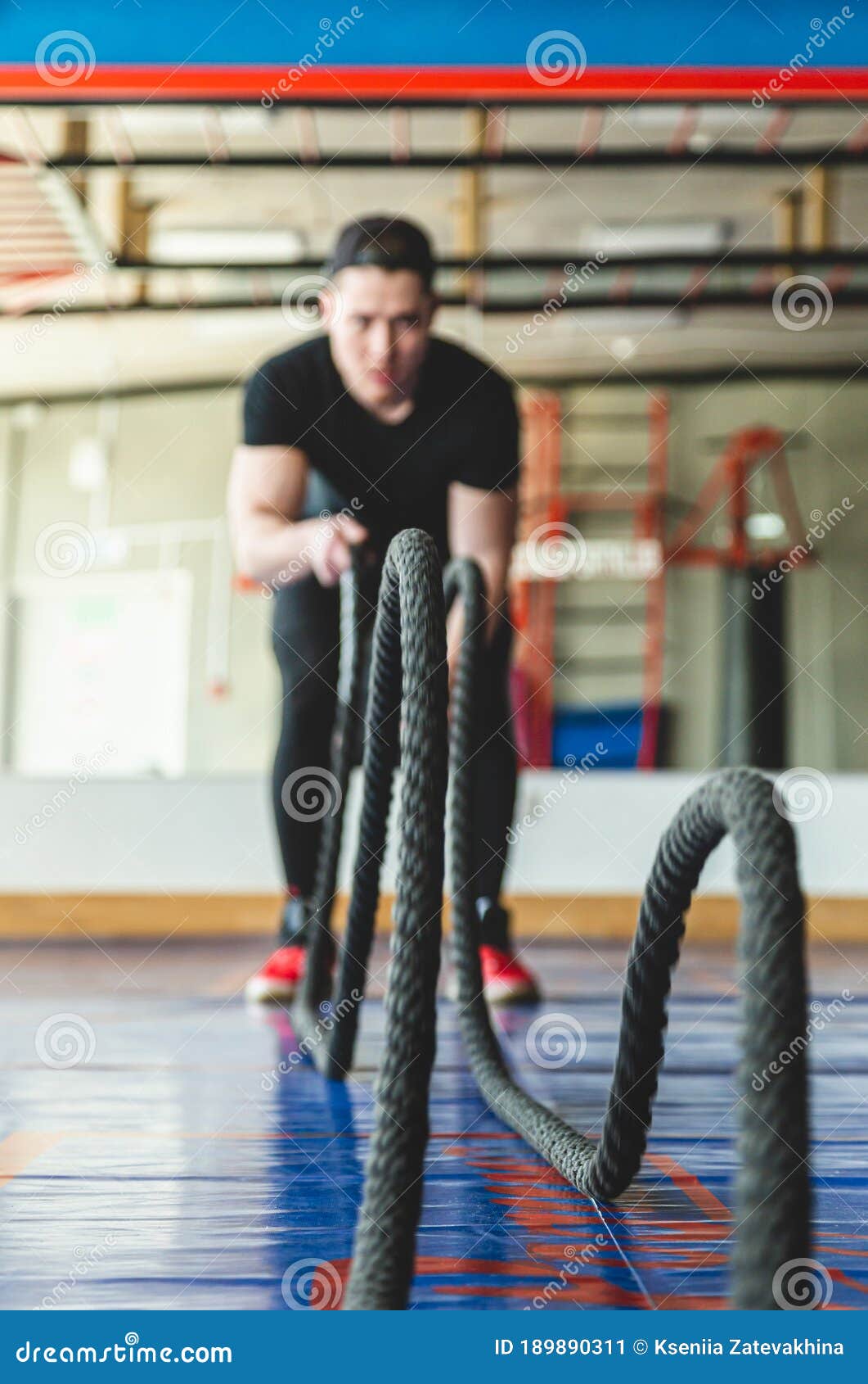 Crossfit with Ropes. the Athlete is Training in the Gym. Stock Image ...