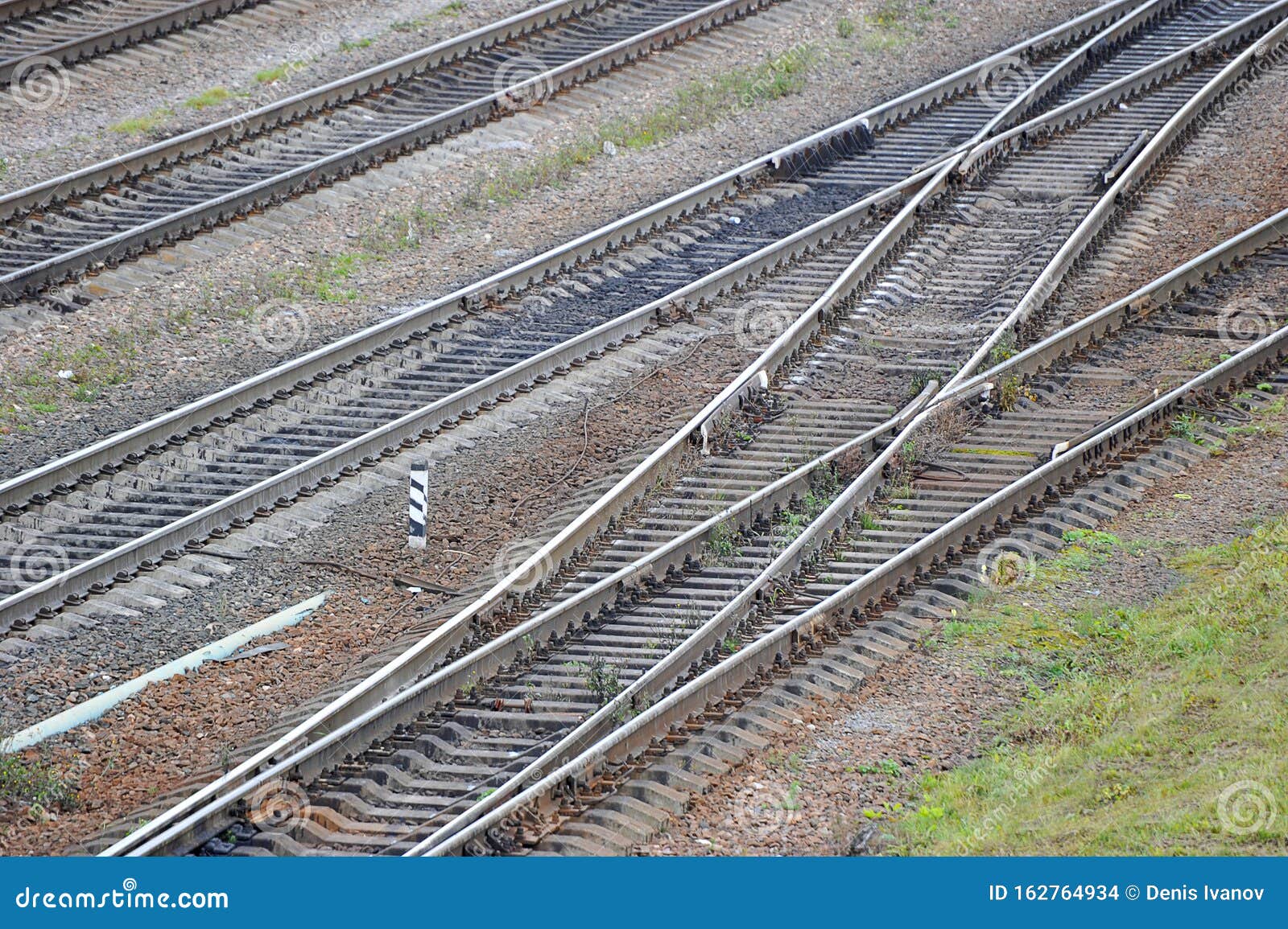 Crossing railway tracks stock photo. Image of station - 162764934