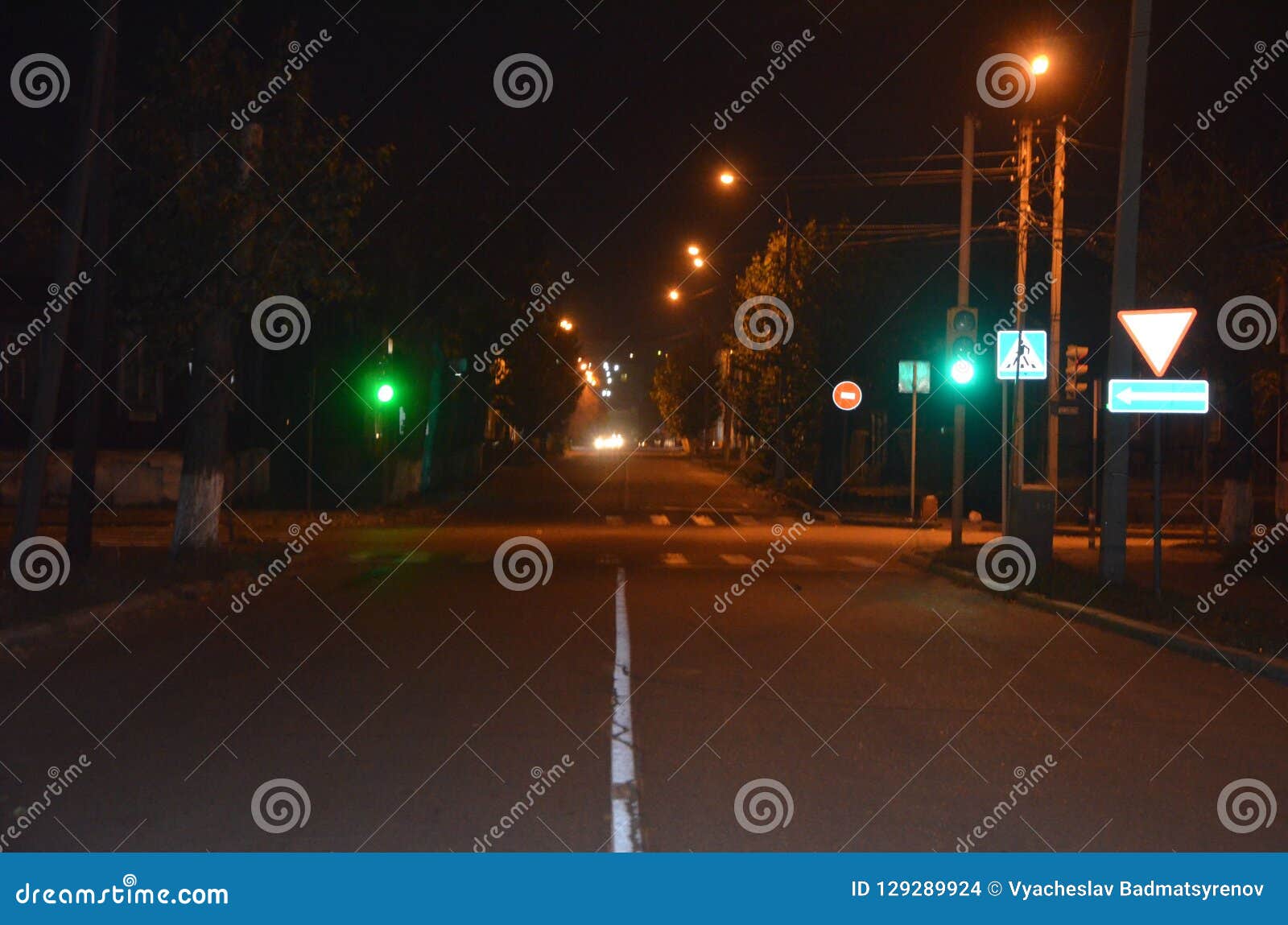 A crossroad at night stock photo. Image of outside, orange - 129289924