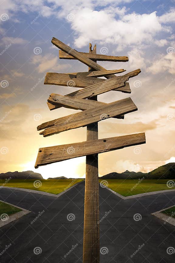 Crossroads with Confusing Directional Arrow Sign Stock Photo - Image of ...