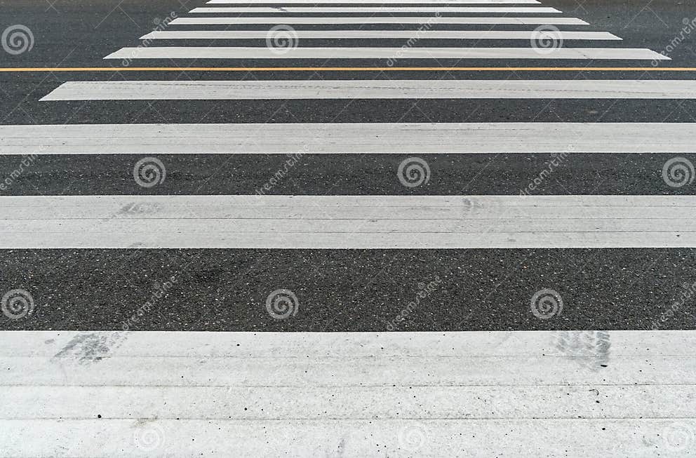 Crosswalk on asphalt road stock photo. Image of pattern - 77808430