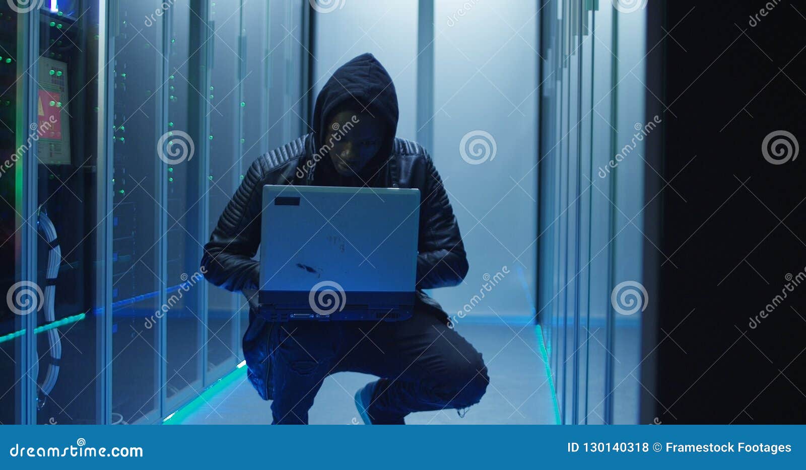 Crouched Hacker in a Data Center Stock Photo - Image of password ...