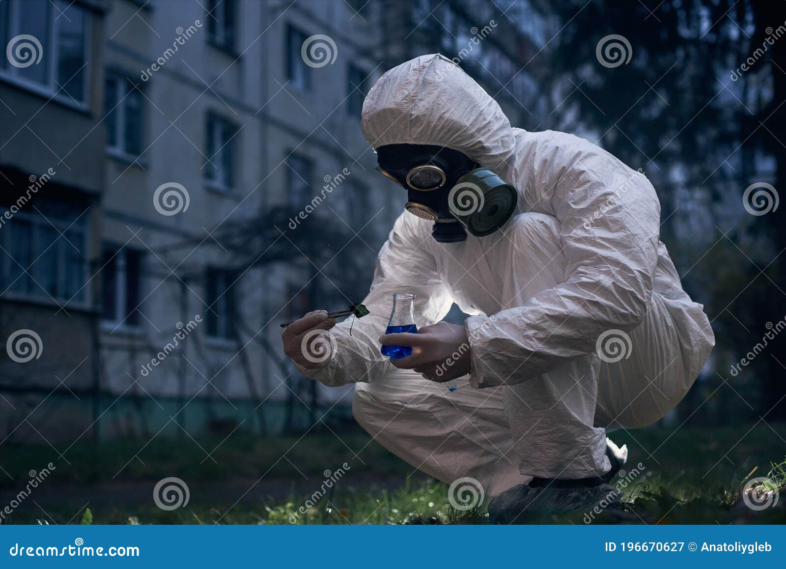 Scientist Doing Research Outdoors, Wearing White Coverall and Gas Mask ...