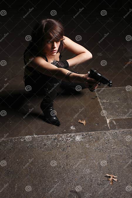 Crouching woman aiming gun stock photo. Image of lipstick - 7379720