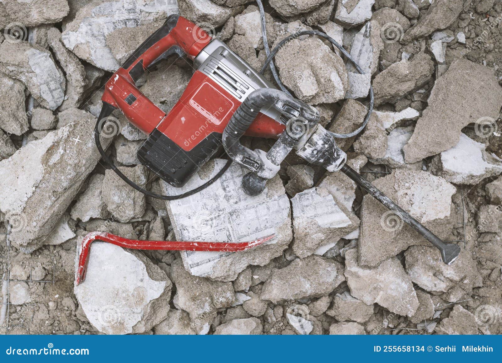 The Crowbar and Jackhammer Lies on Large Pieces of Broken Cement Walls ...