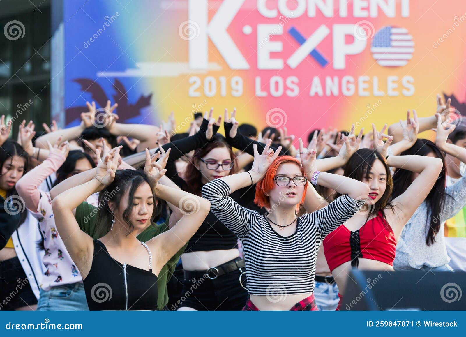 Crowd of Fans of KPop Participating in a Group Dance Activity Called ...