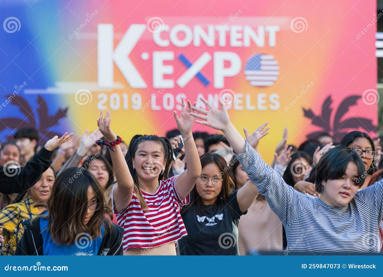 Crowd of Fans of KPop Participating in a Group Dance Activity Called ...