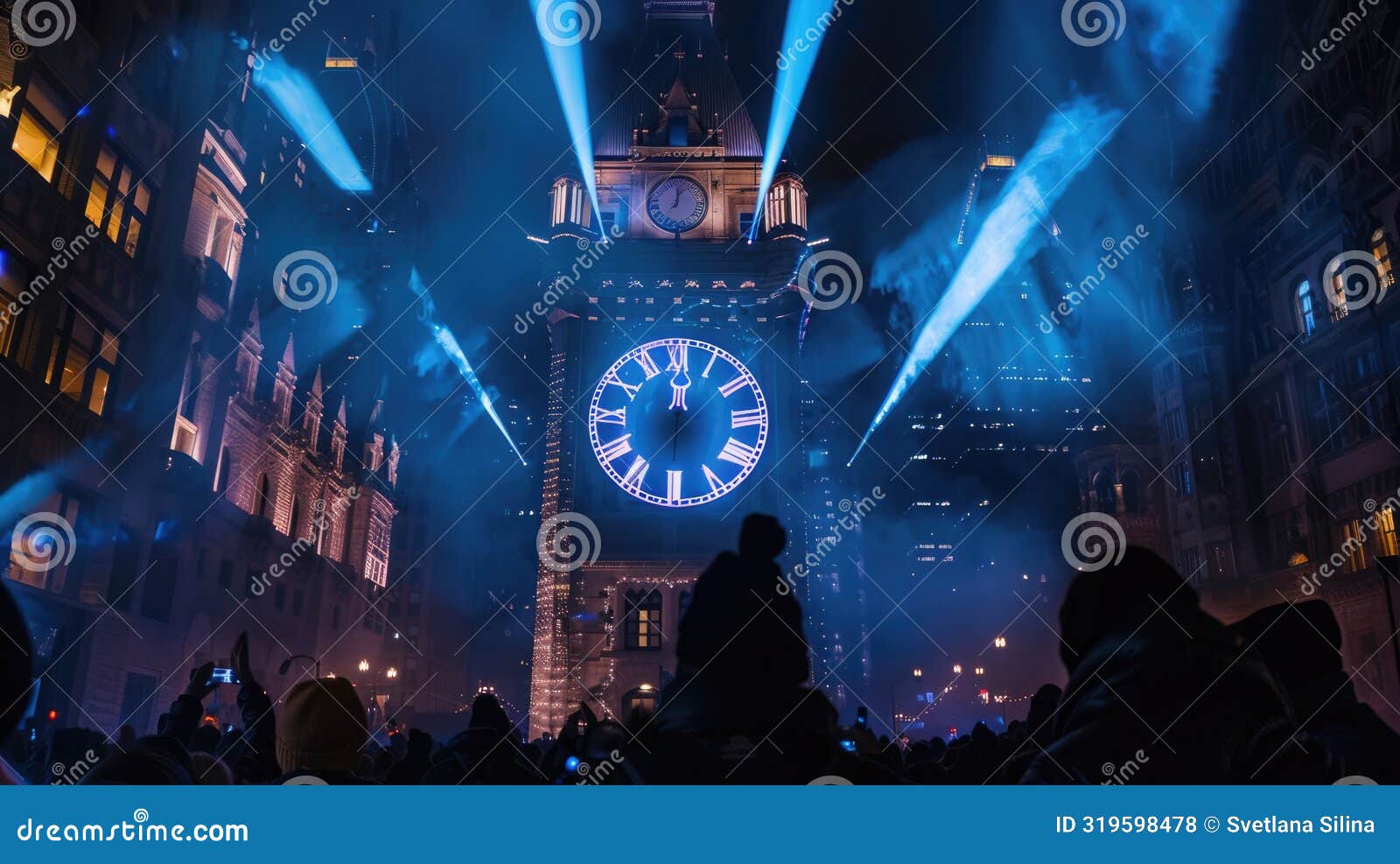 Crowd Gathered before a Lit Clock Tower with 2025 Projection ...