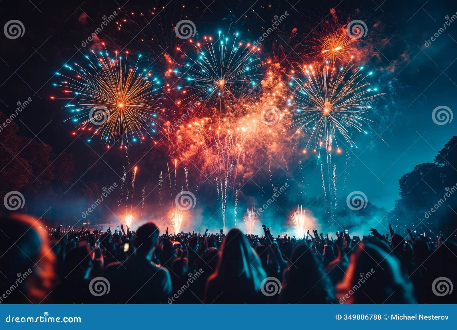 Crowd of People is Enjoying a Fireworks Display at an Outdoor Event ...