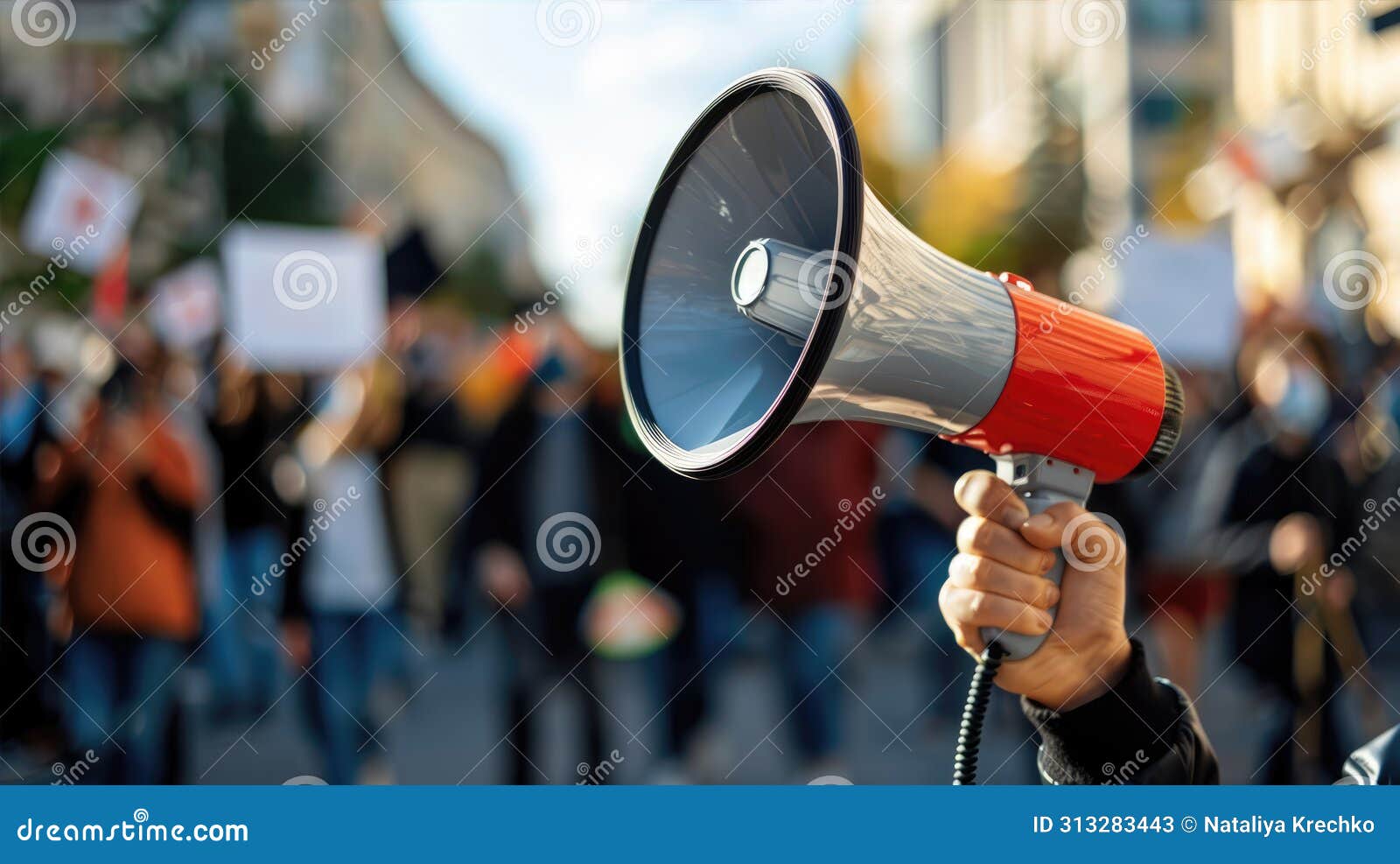 Crowd Protesting in the Street with Focus on Loud Speaker in Hand Stock ...
