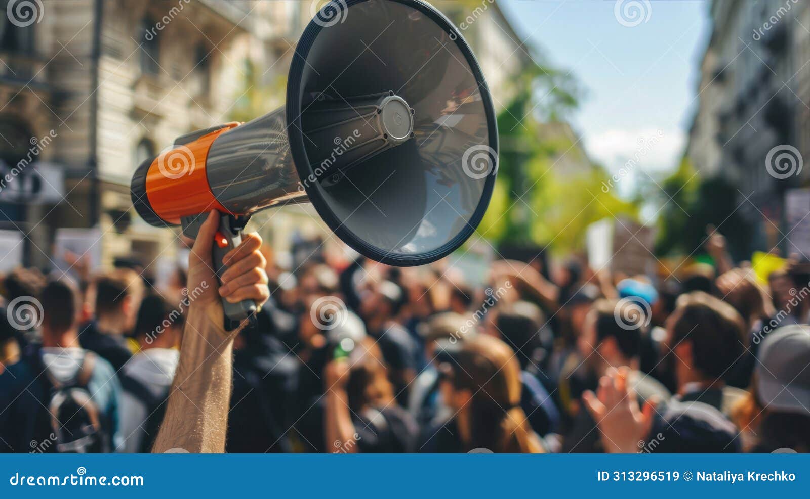 Crowd Protesting in the Street with Focus on Loud Speaker in Hand Stock ...