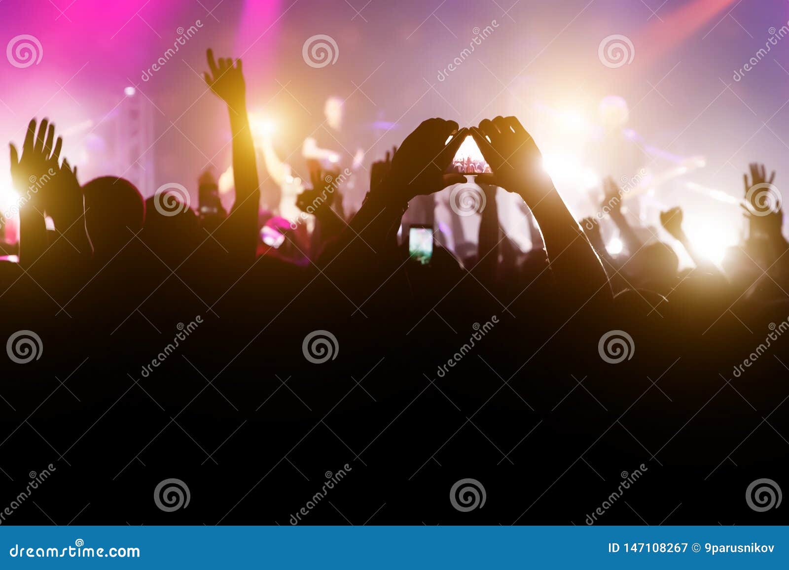 Crowd with Raised Hands and Smartphone Record a Concert Stock Image ...