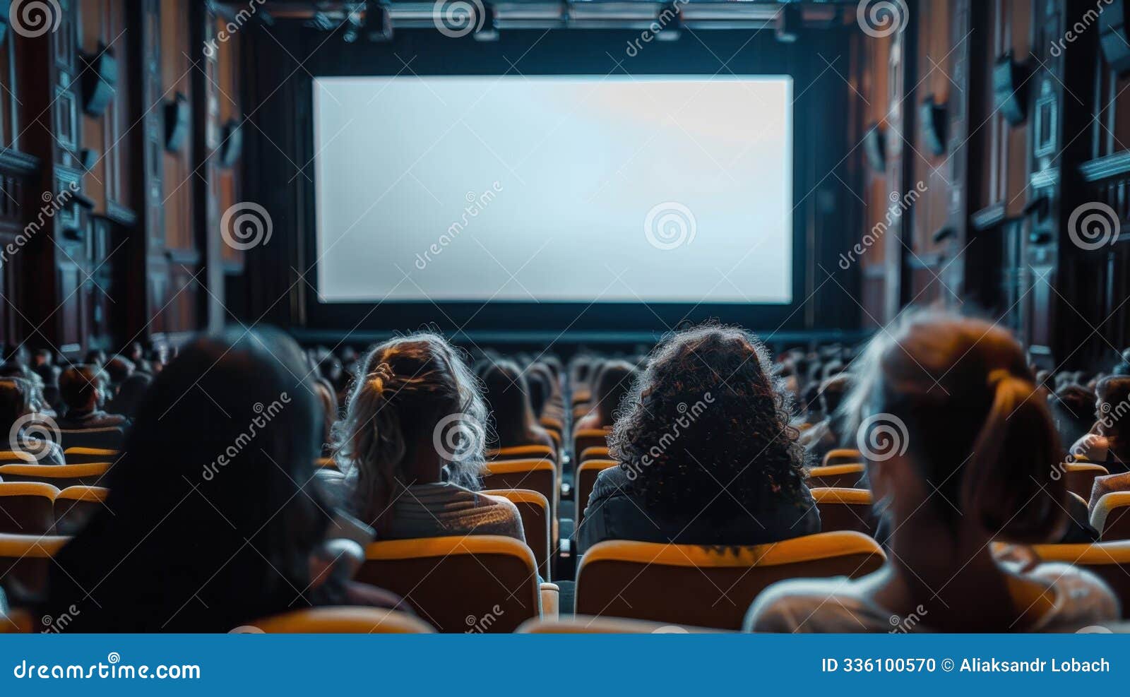 A Crowd of Spectators in the Dark Watching a White Screen in a Movie ...