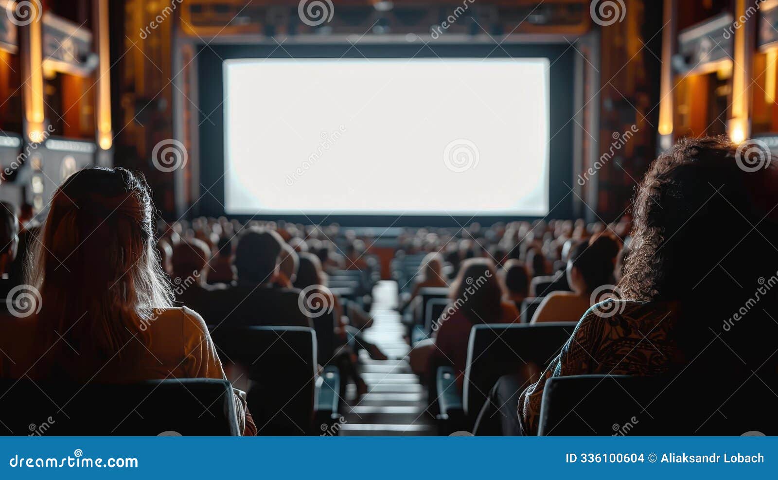 A Crowd of Spectators in the Dark Watching a White Screen in a Movie ...