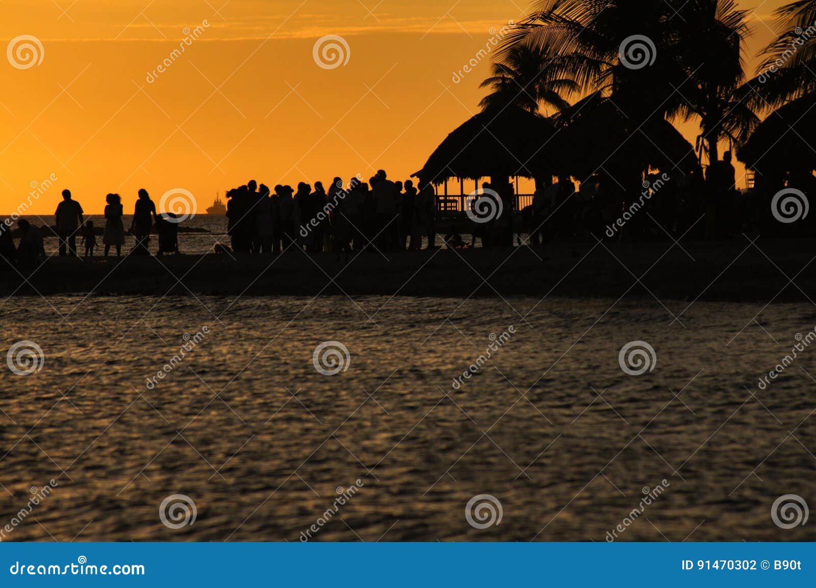 Crowd in sunset stock photo. Image of people, beach, pier - 91470302