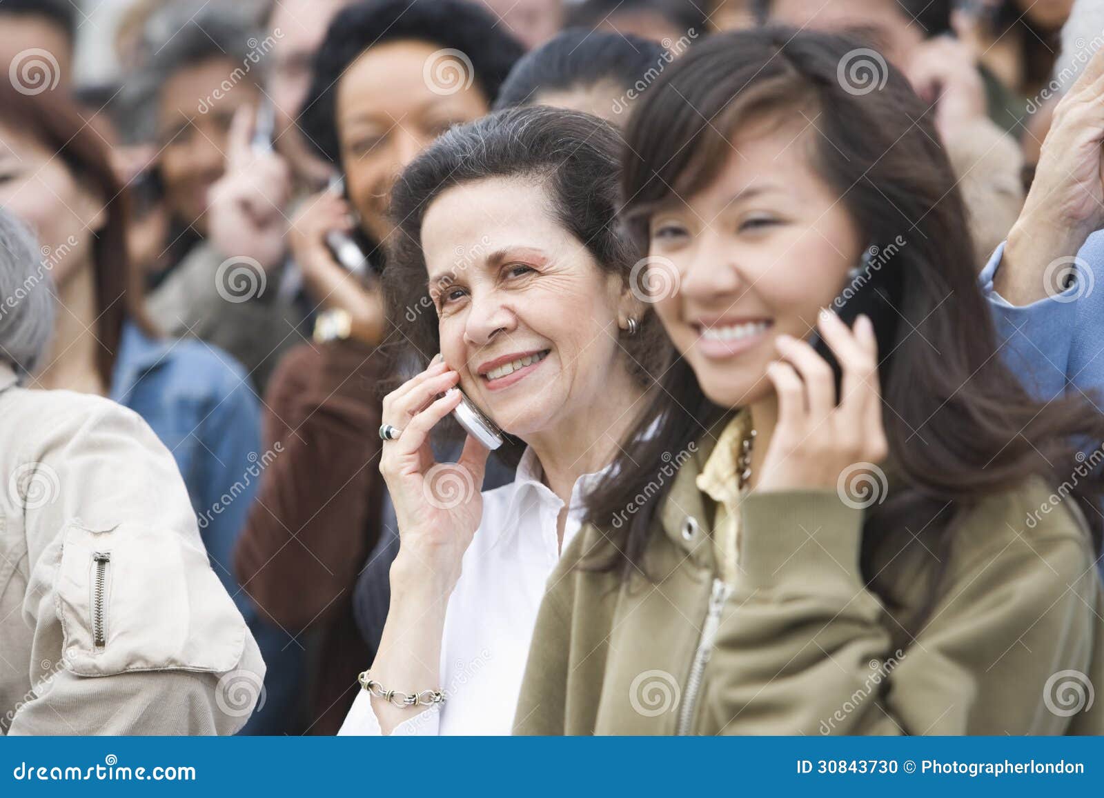 Crowd Using Mobile Phones stock photo. Image of cooperation - 30843730