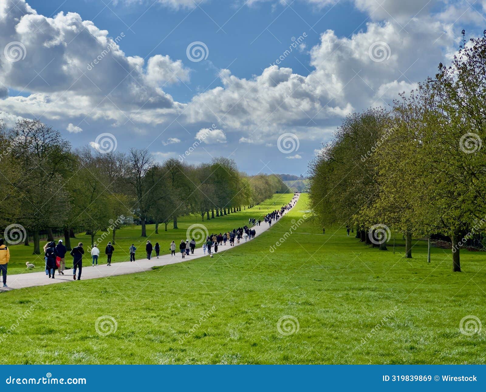 The Crowd is Walking in a Row on the Path that Goes To the Left ...