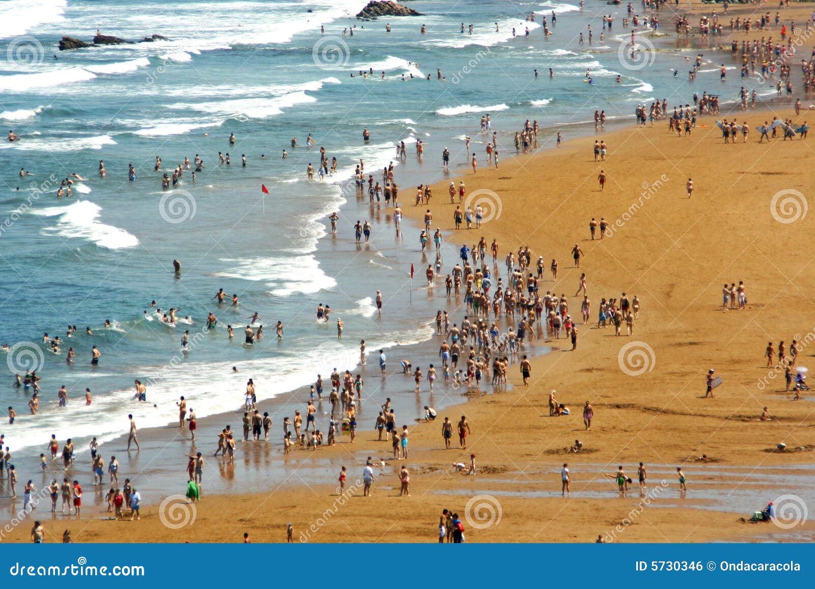 Crowded beach stock photo. Image of blue, holidays, ocean - 5730346