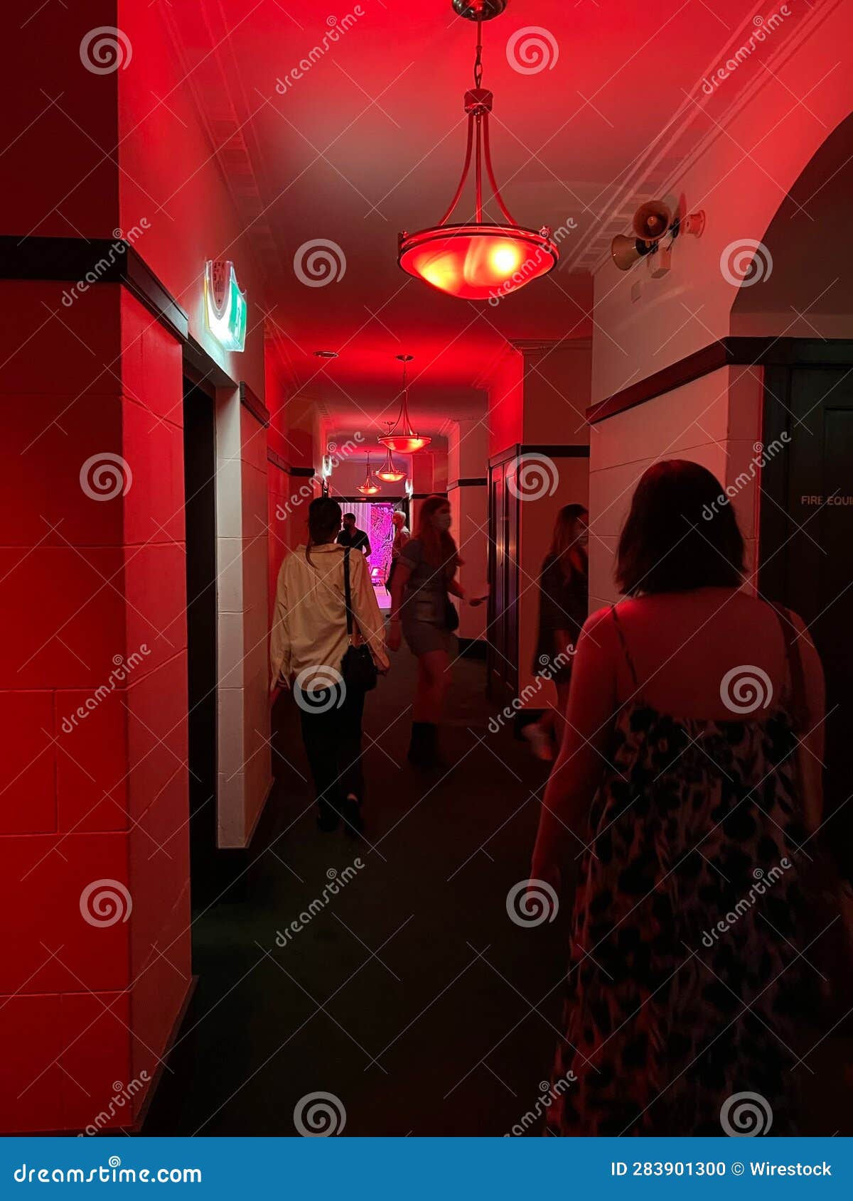 Crowded Pathway with Dimly Lit Red Light Stock Photo - Image of winding ...