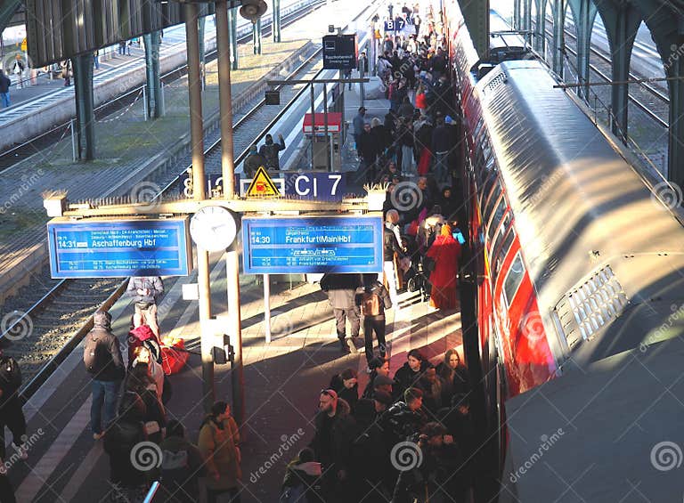 Crowded Platform with Red Train in Winter Editorial Photography - Image ...