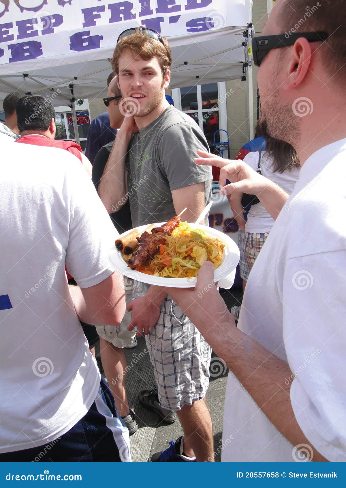 Crowds sample the food editorial stock photo. Image of crowd - 20557658