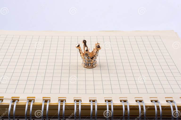 Crown with a notebook stock photo. Image of business - 70306690