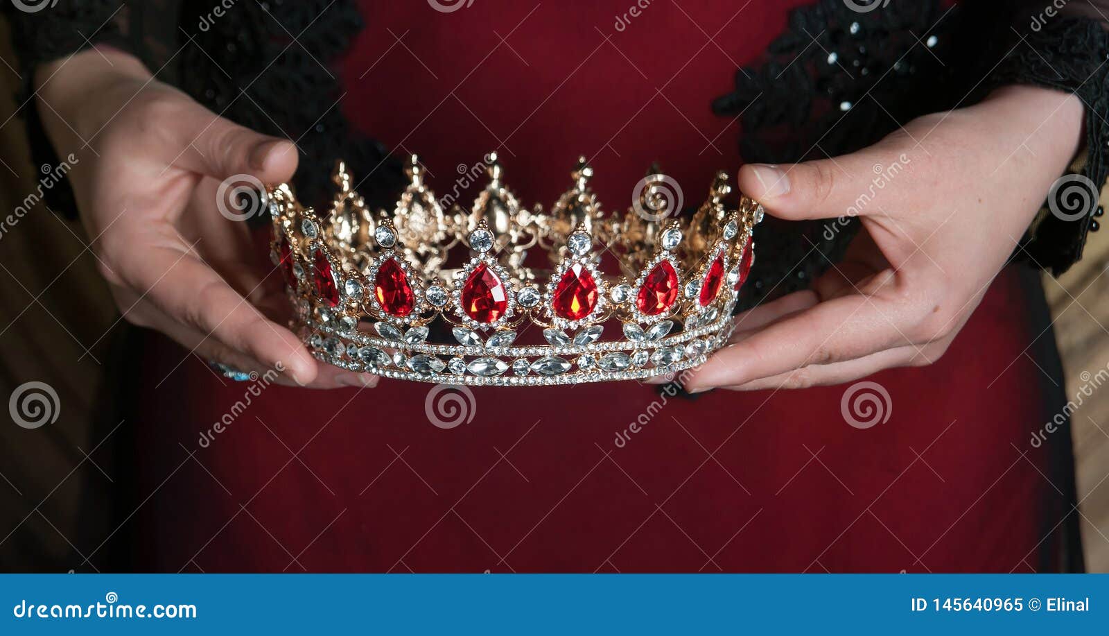 Crown with Red Gemstones in Hands. Succesful Stock Image - Image of ...