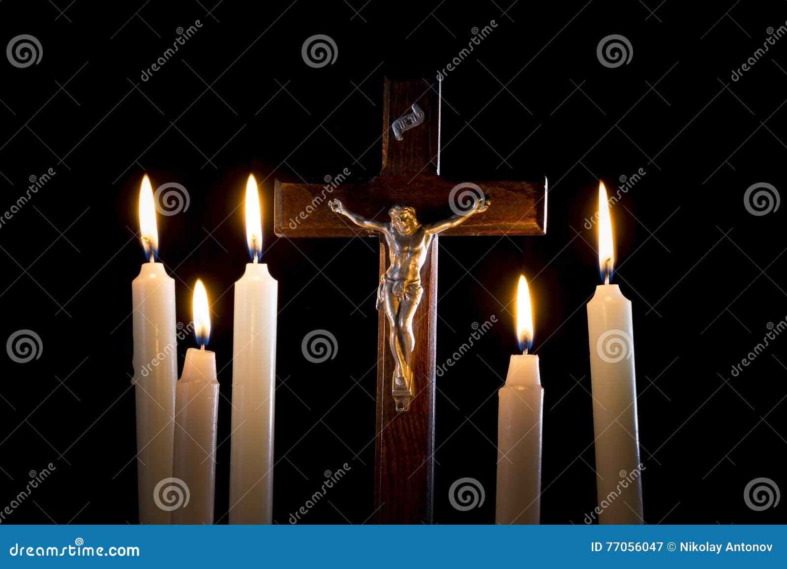 Crucifix among Lighting Candles on Black Background Stock Image - Image ...
