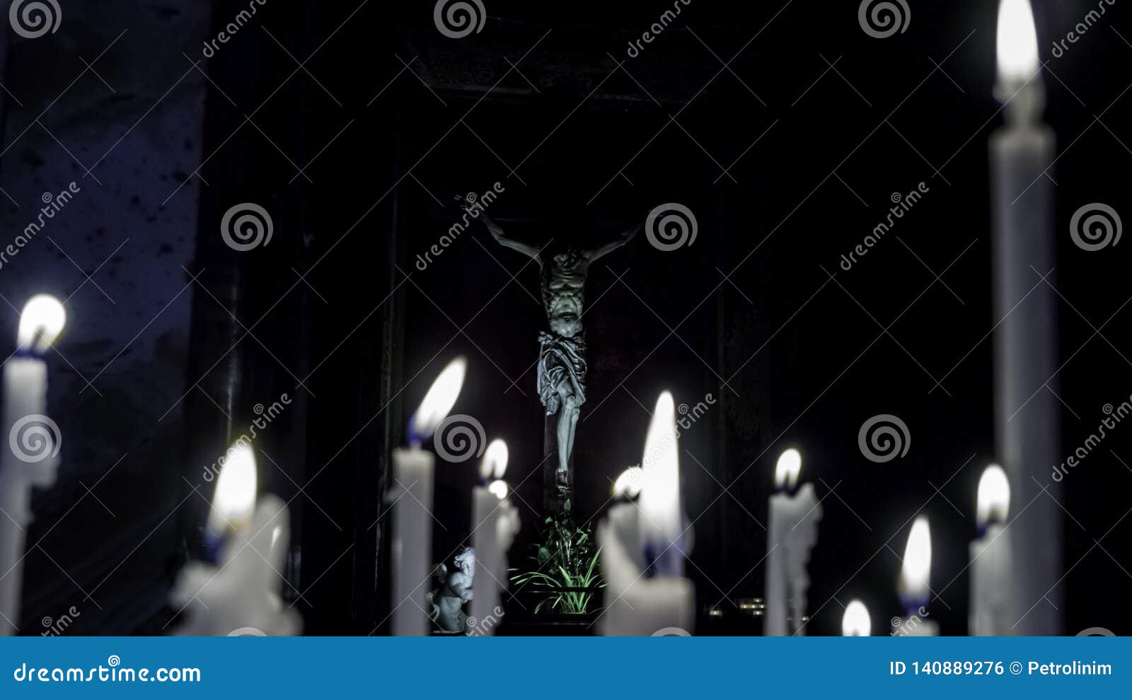 Crucifix in the Middle of Lighted Candles Stock Photo - Image of ...