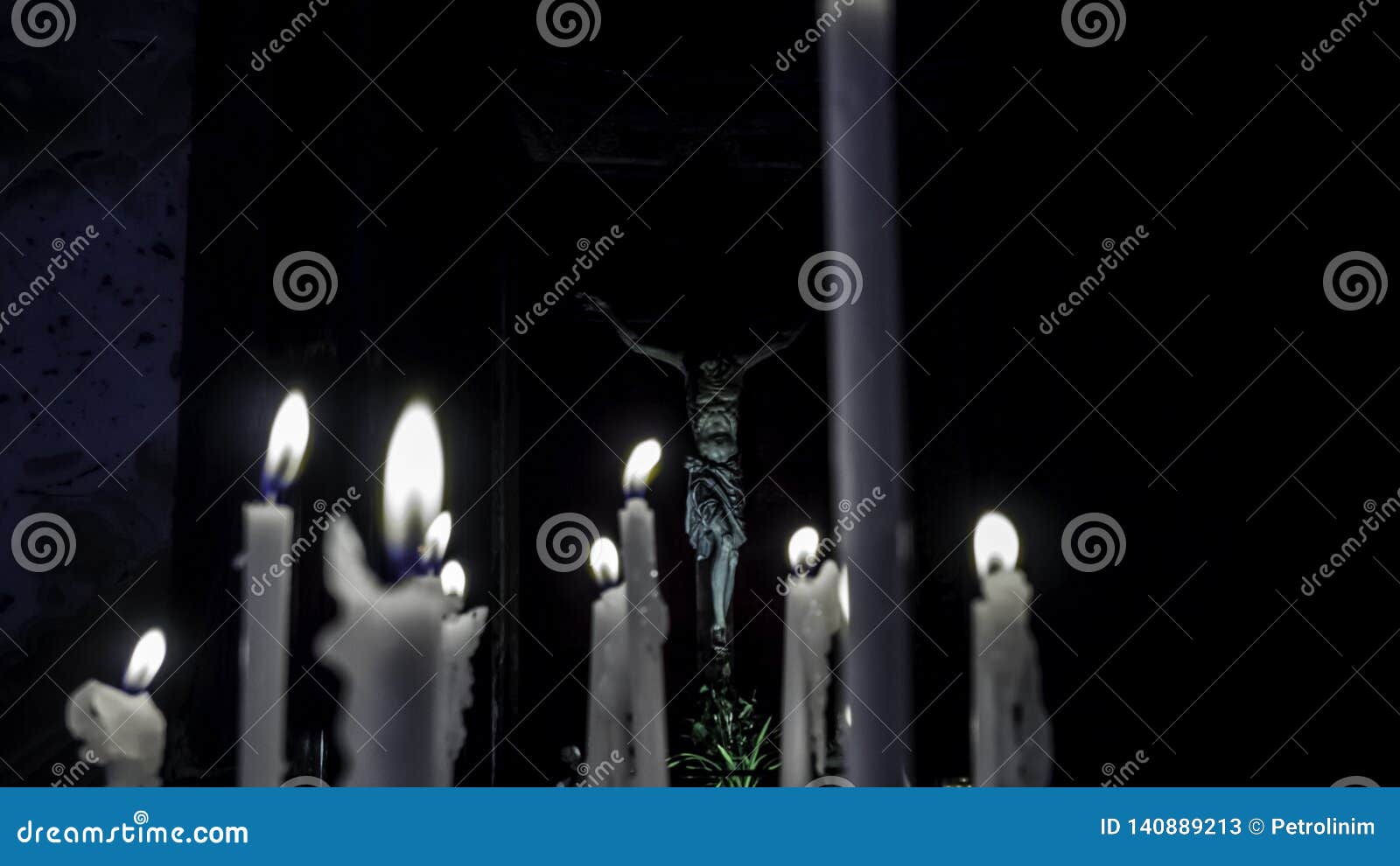 Crucifix in the Middle of Lighted Candles Stock Image - Image of ...
