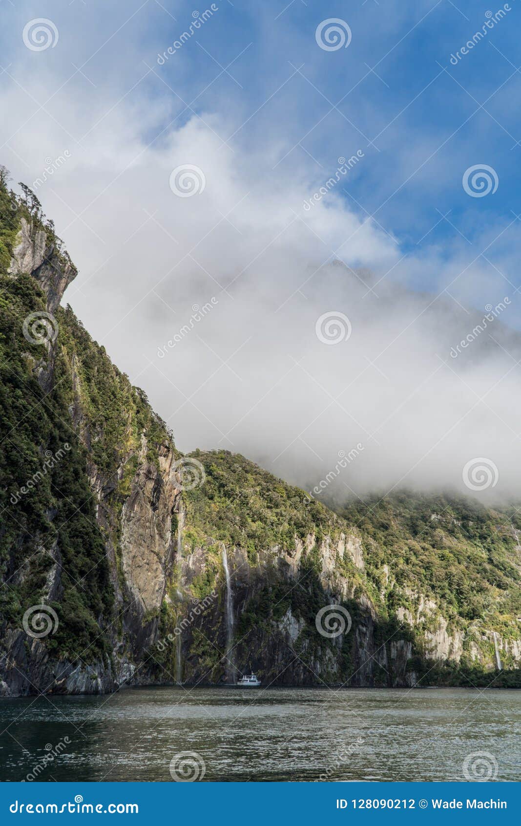 Cruise Ship in Milford Sound Beneath Waterfall Stock Photo - Image of ...