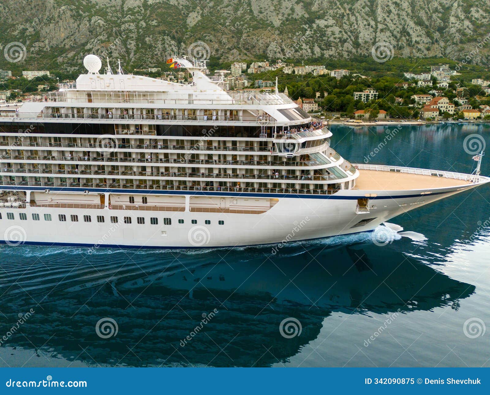 Cruise Ship Sailing in the Bay To the Berth, Side View of the Decks and ...