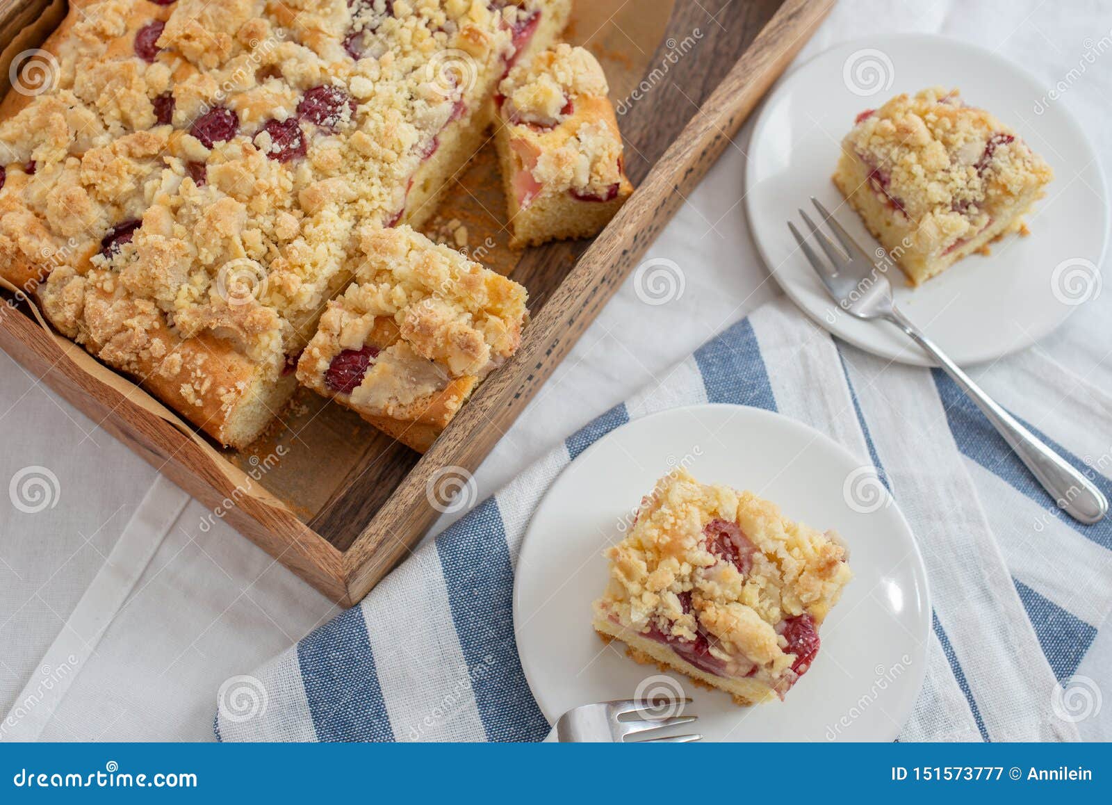 Crumble Cake in a Baking Form and Pieces of the Cake on a Table Stock ...