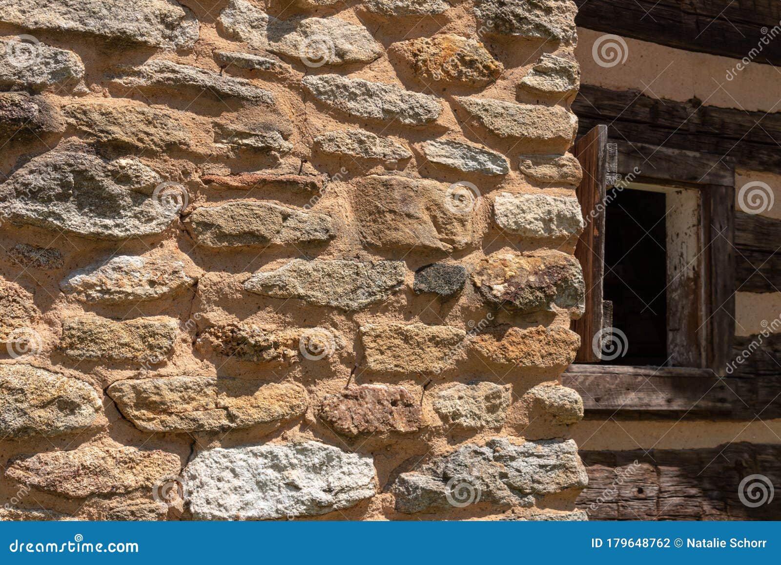 Crumbling Stone Wall of a Building with Open Window in Shadows ...